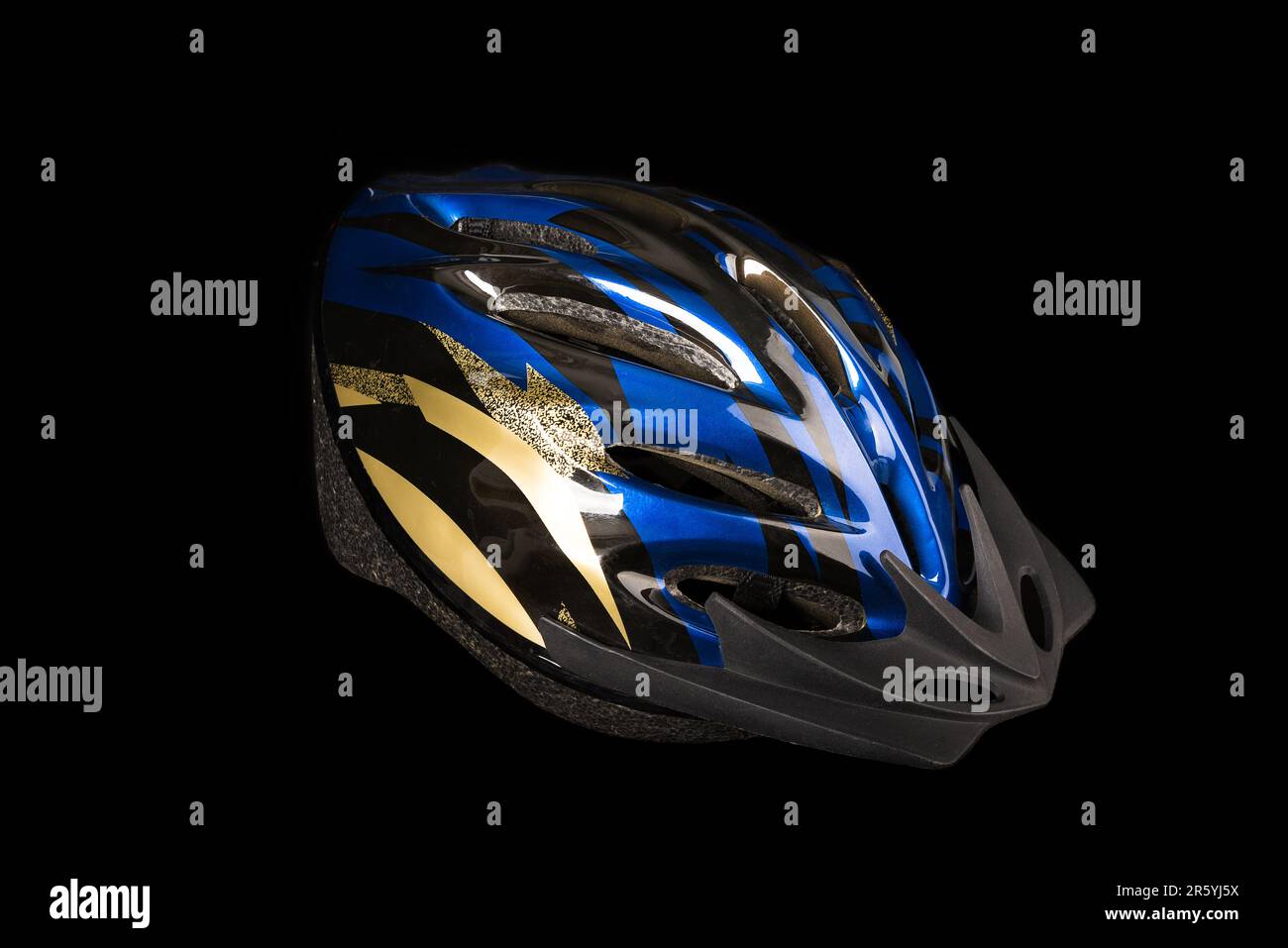 Bicycle polystyrene helmet on a black background Stock Photo - Alamy