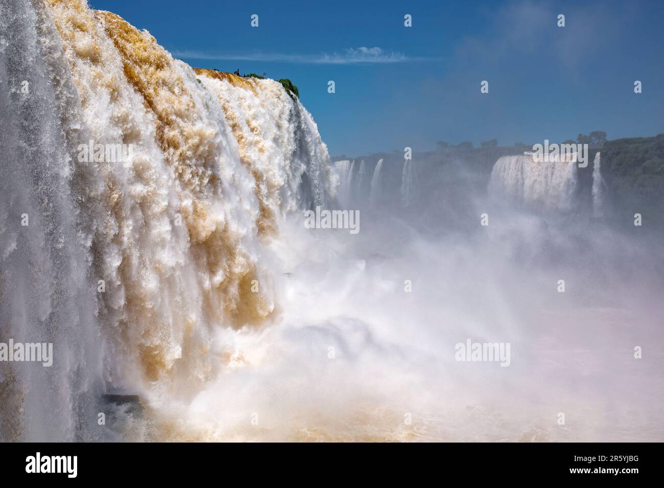Close-up view of powerful Iguazu Falls in sunshine Stock Photo - Alamy