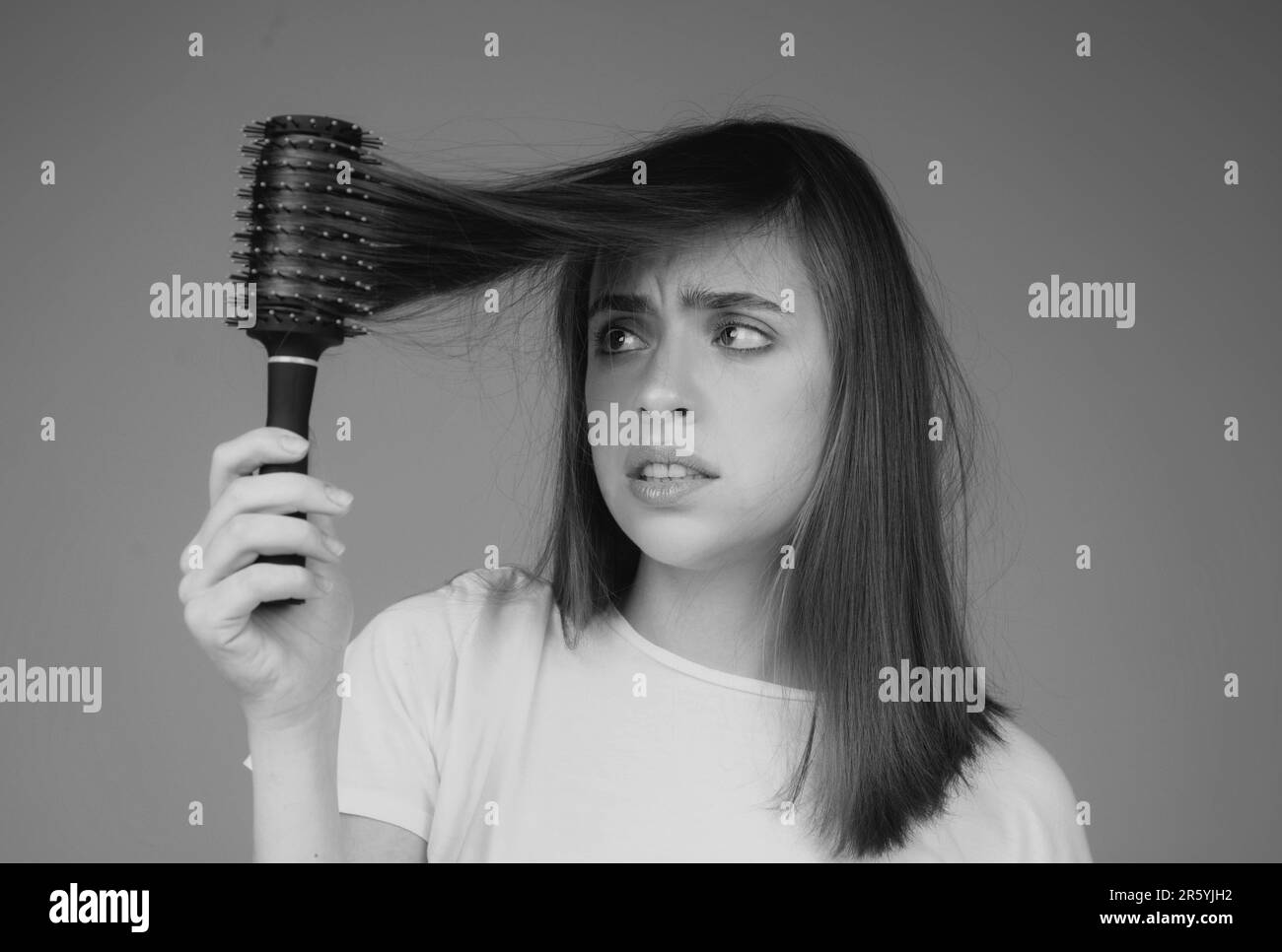 Sad woman with hair loss problem worried about hair loss Stock Photo ...