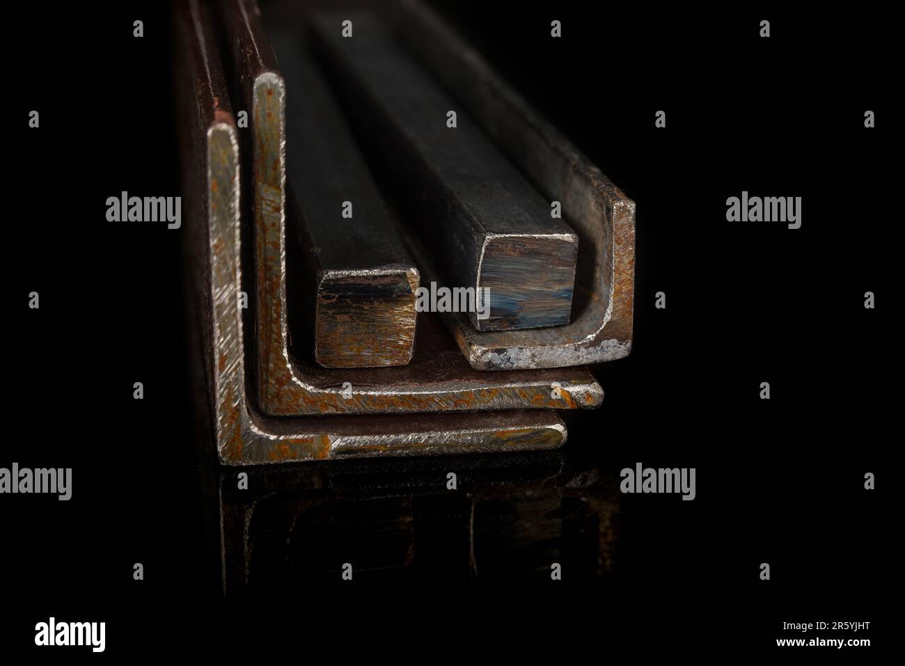 Construction metal profile on a black background Stock Photo - Alamy