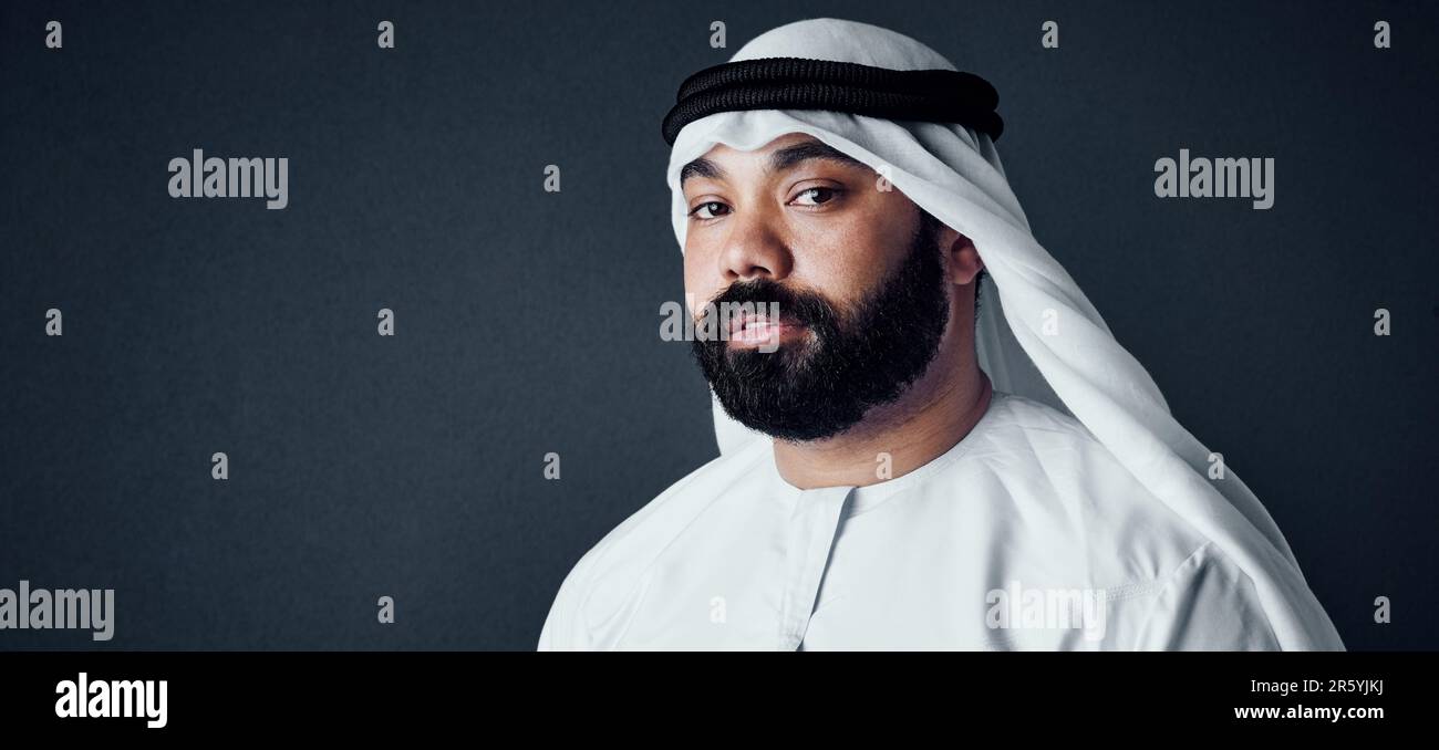 He loves the traditional look. Studio shot of a young man dressed in ...