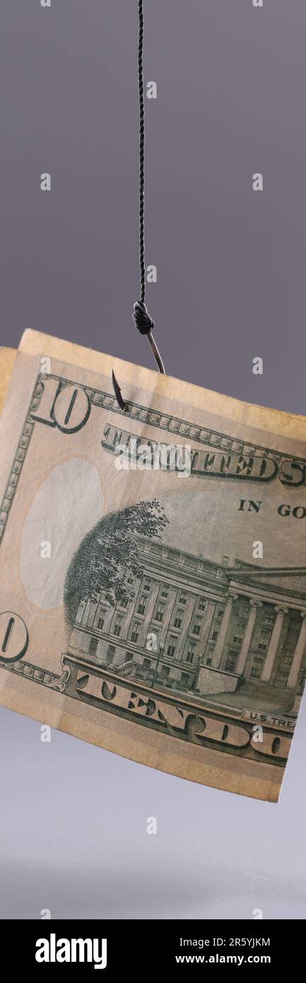 Ten dollars in air on gray background Stock Photo - Alamy