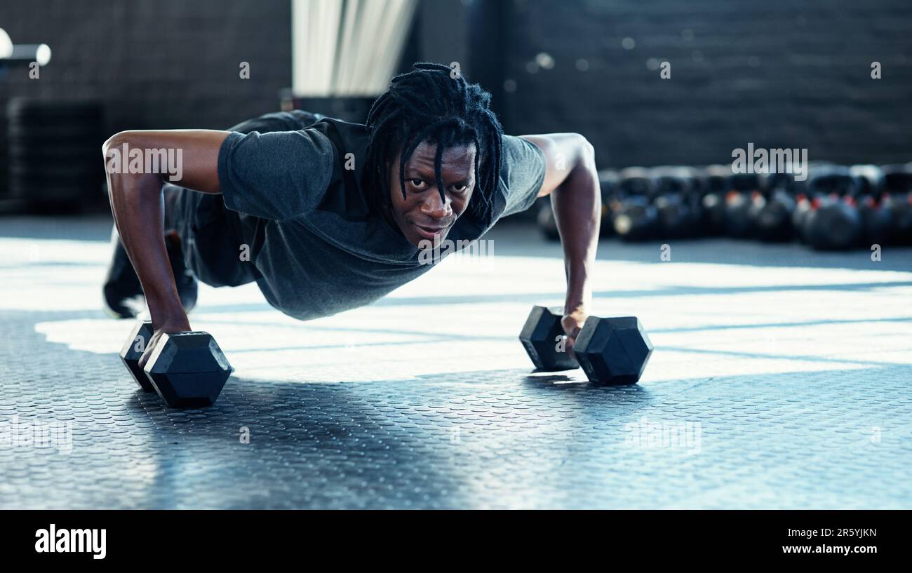When you feel like quitting, push further. a young man doing push ups ...