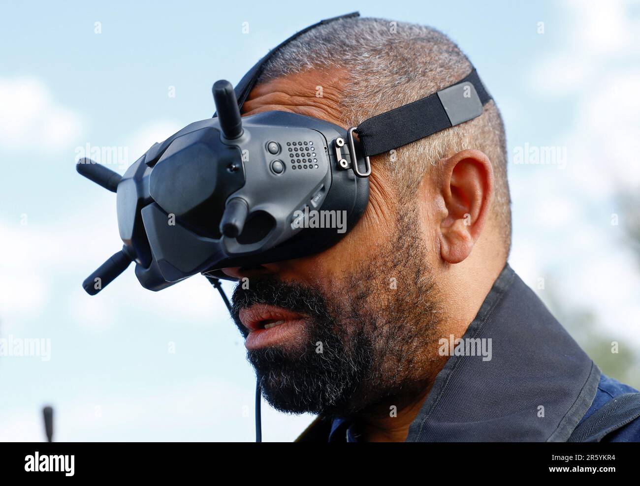 Foreign Secretary James Cleverly operates an unmanned demining vehicle ...