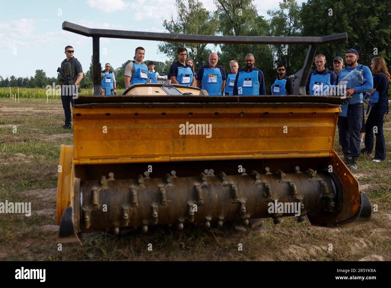 Foreign Secretary James Cleverly looks at an unmanned demining vehicle ...
