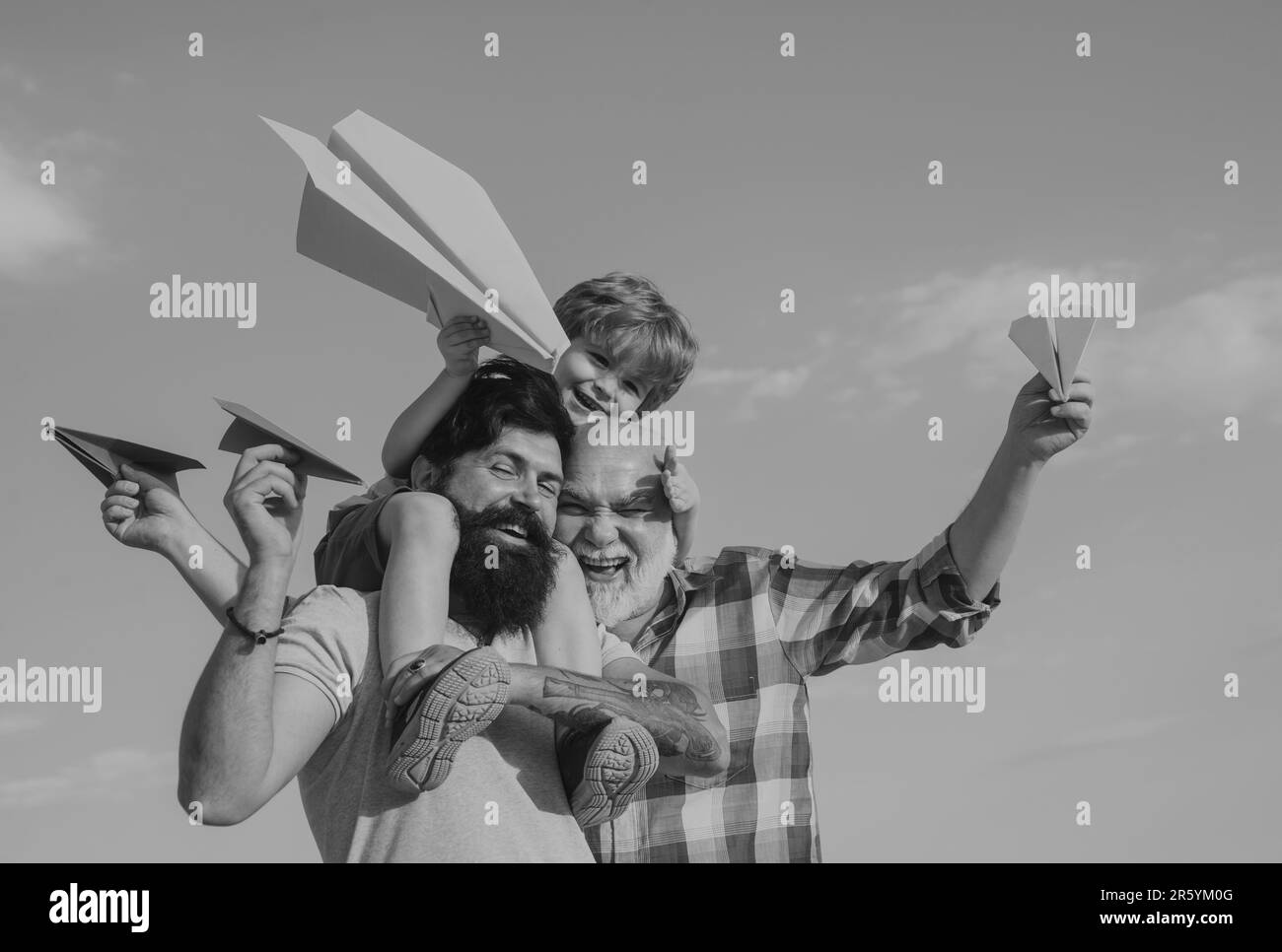 Three different generations ages: grandfather father and child son ...