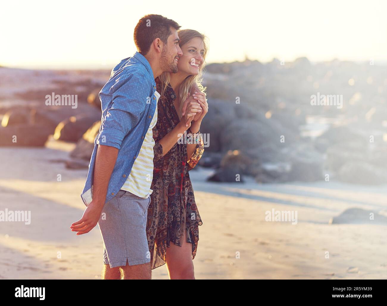 You really made my summer. a happy young couple going for a walk along ...