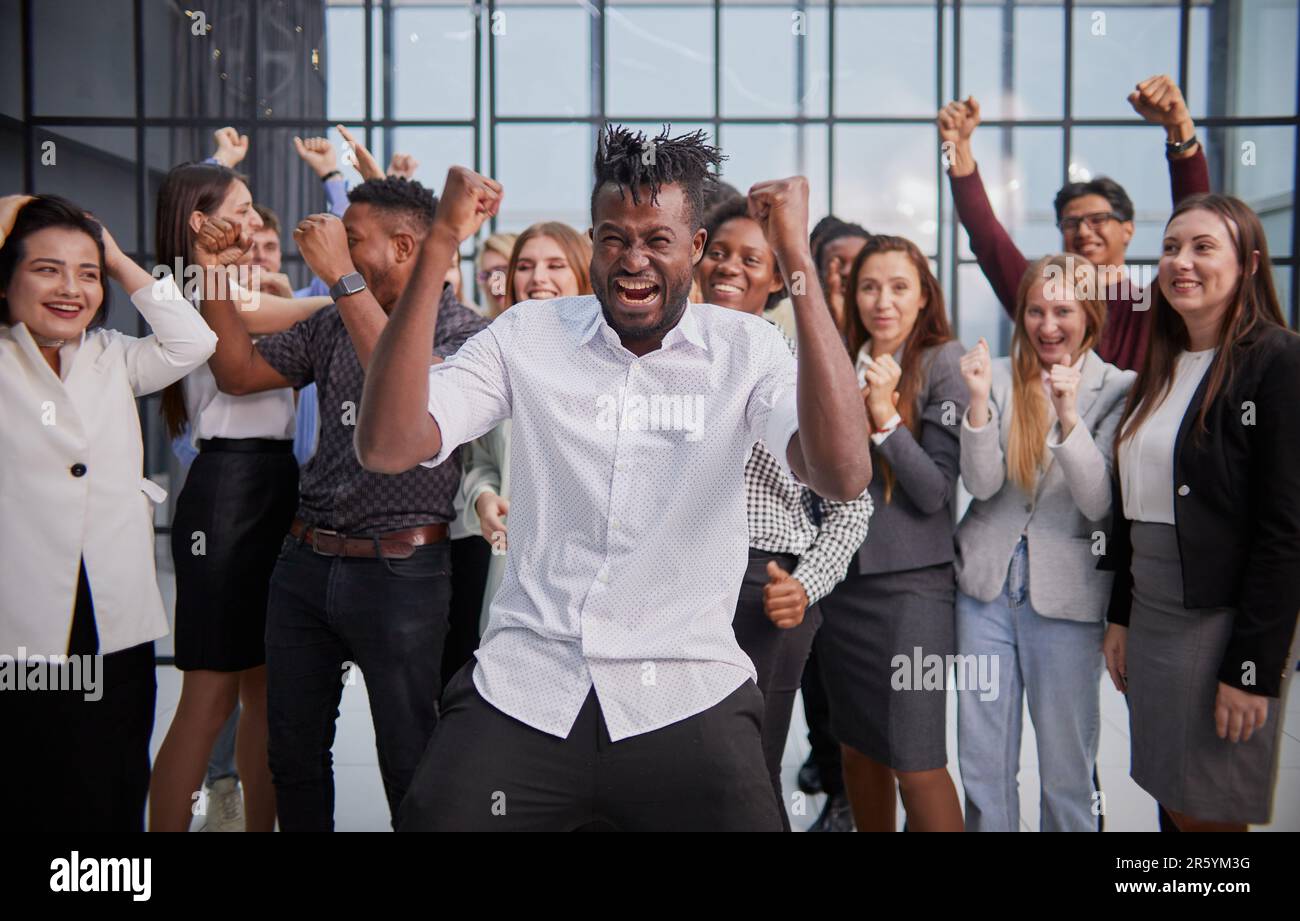 Composition of business executives or partners raised their hands up ...