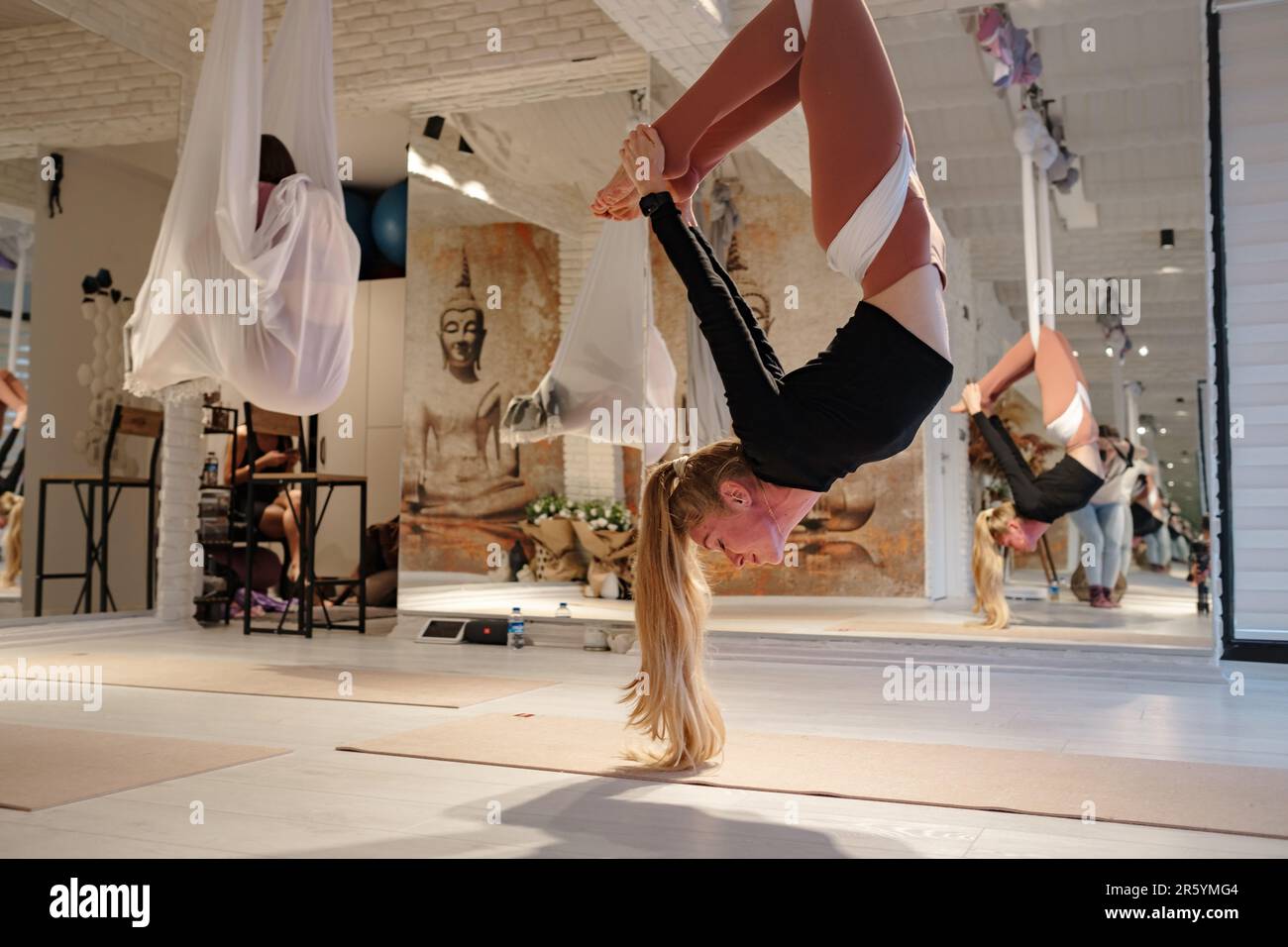 workshop of air yoga and stretching in yoga studio. women practices ...