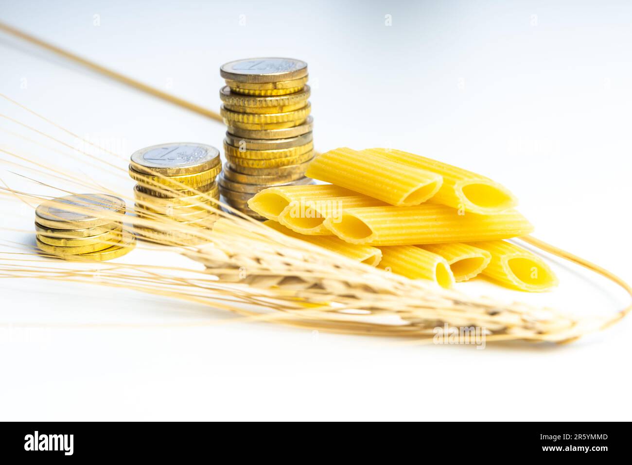 Ear of wheat, with pasta (pennette) and coins next to it. Increase in ...