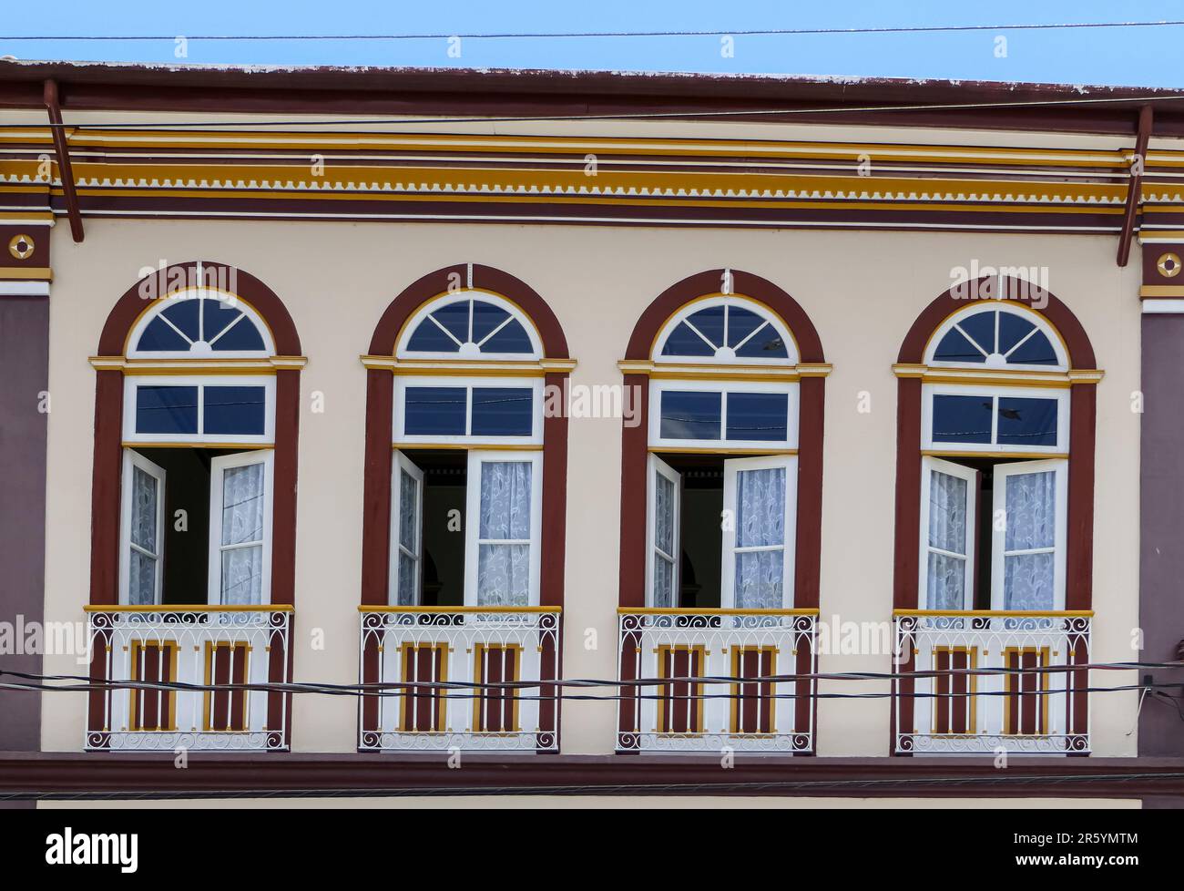 Close-up of a colonial house facade with windows and doors in ...