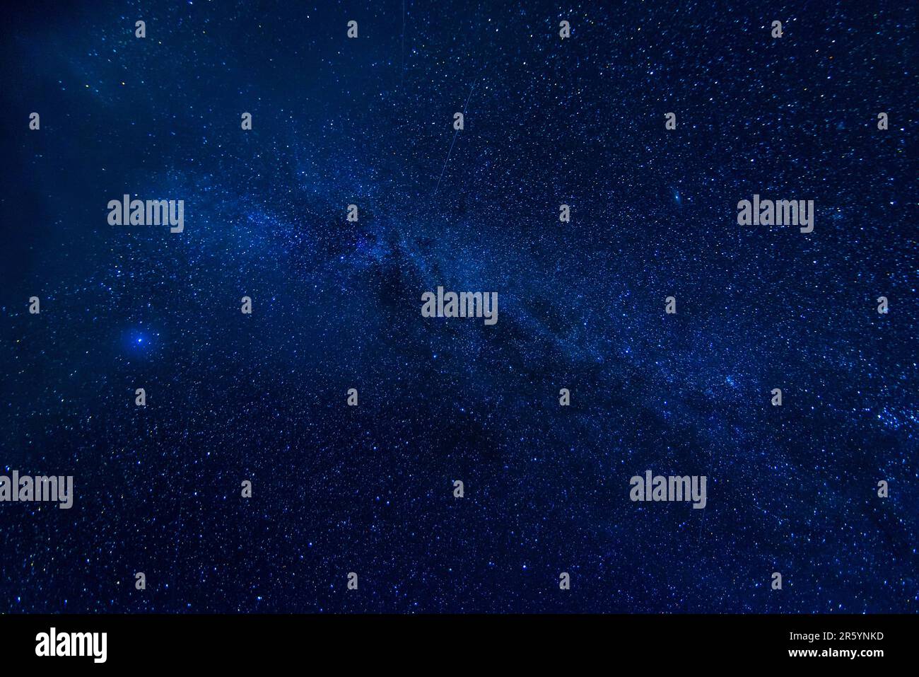 blue starry night sky with the milky way and galaxies. Astrophotography ...