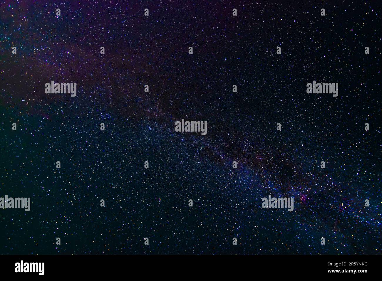 starry multicolored night sky with a bright milky way and galaxies ...