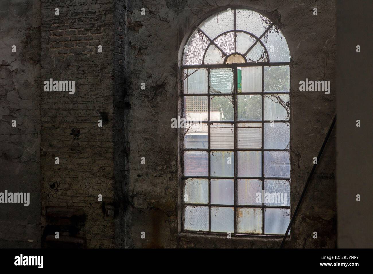 windows of an old abandoned industrial warehouse building Stock Photo ...