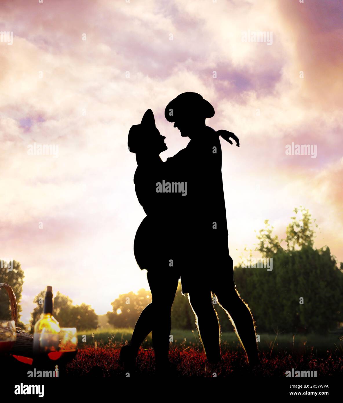 Couple hugging on picnic blanket hi-res stock photography and images ...