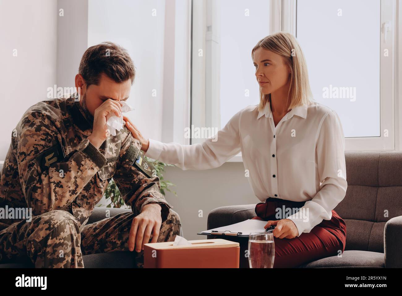 Psychologist working with military officer in office Stock Photo - Alamy