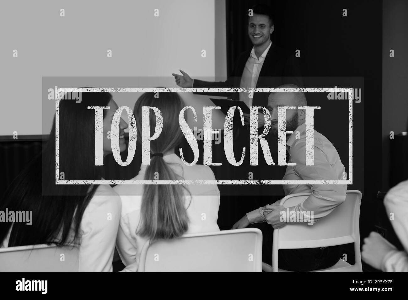 Classified information. Stamp Top Secret on black and white photo of ...