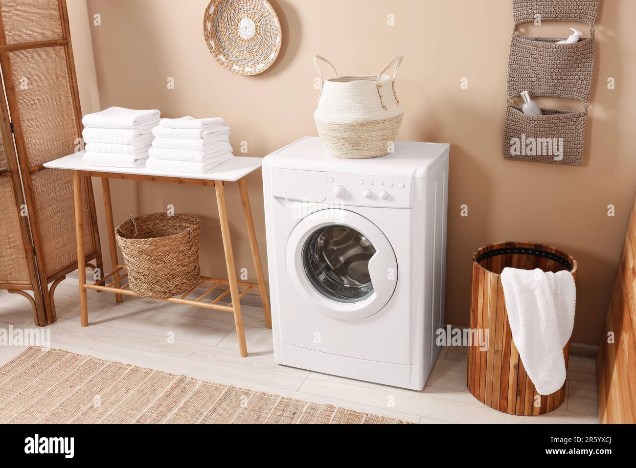 Stylish laundry room with modern washing machine. Interior design Stock ...