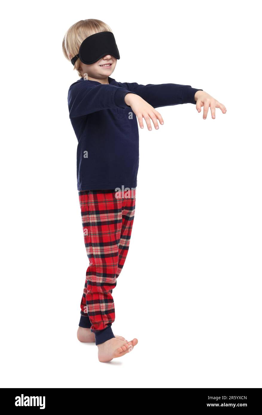 Boy in pajamas and sleep mask sleepwalking on white background Stock ...
