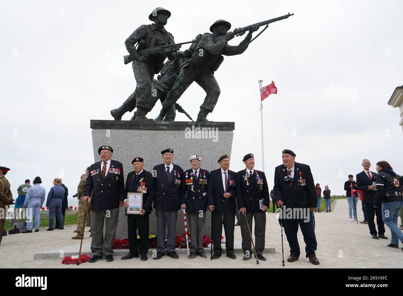 D-Day veterans pose for pictures at the British Normandy memorial statue after the Royal British ...