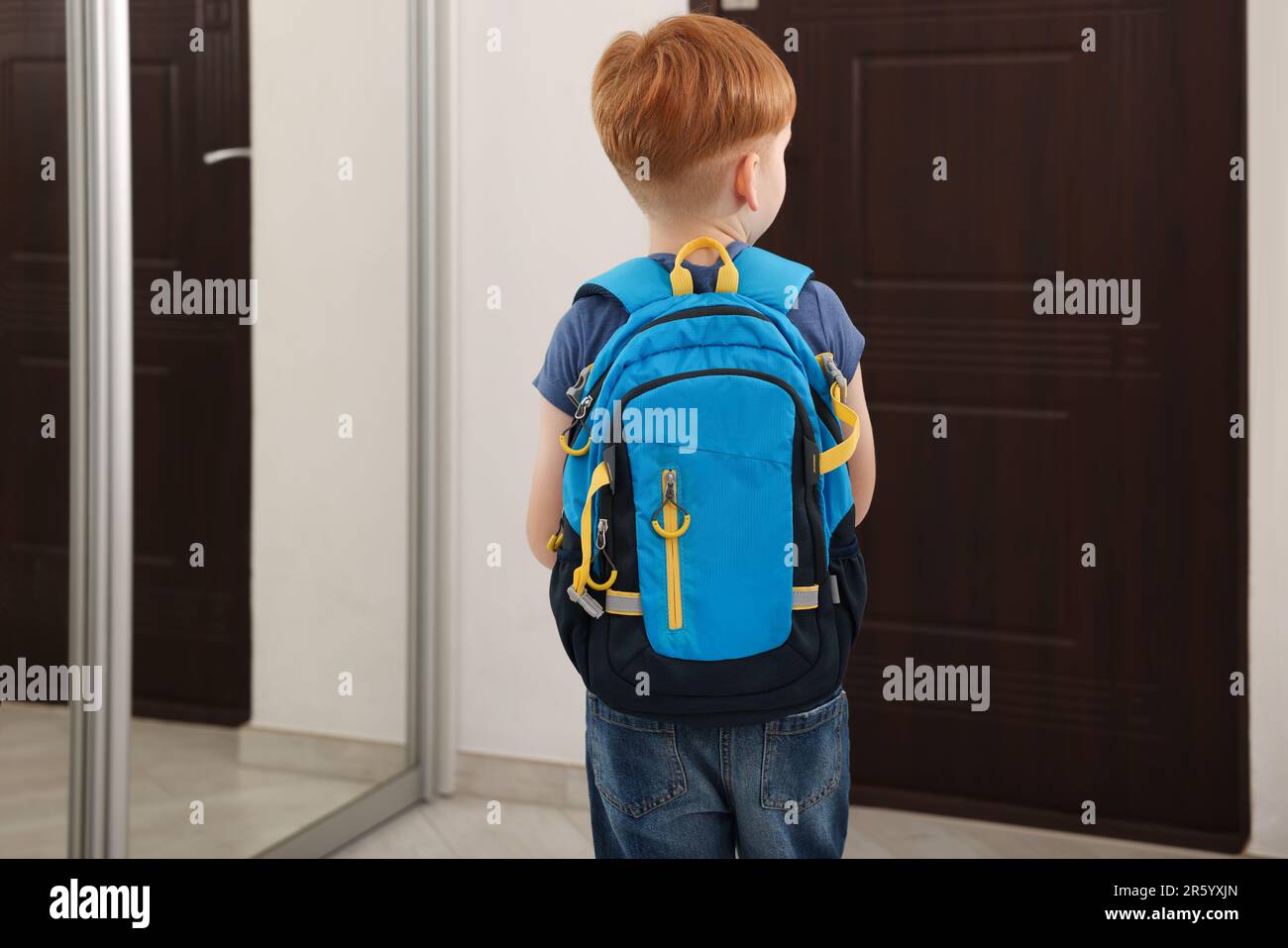 Little boy with backpack going to school, back view Stock Photo - Alamy
