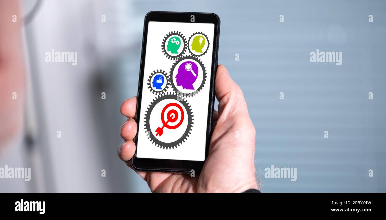 Hand holding a smartphone with business process concept Stock Photo - Alamy