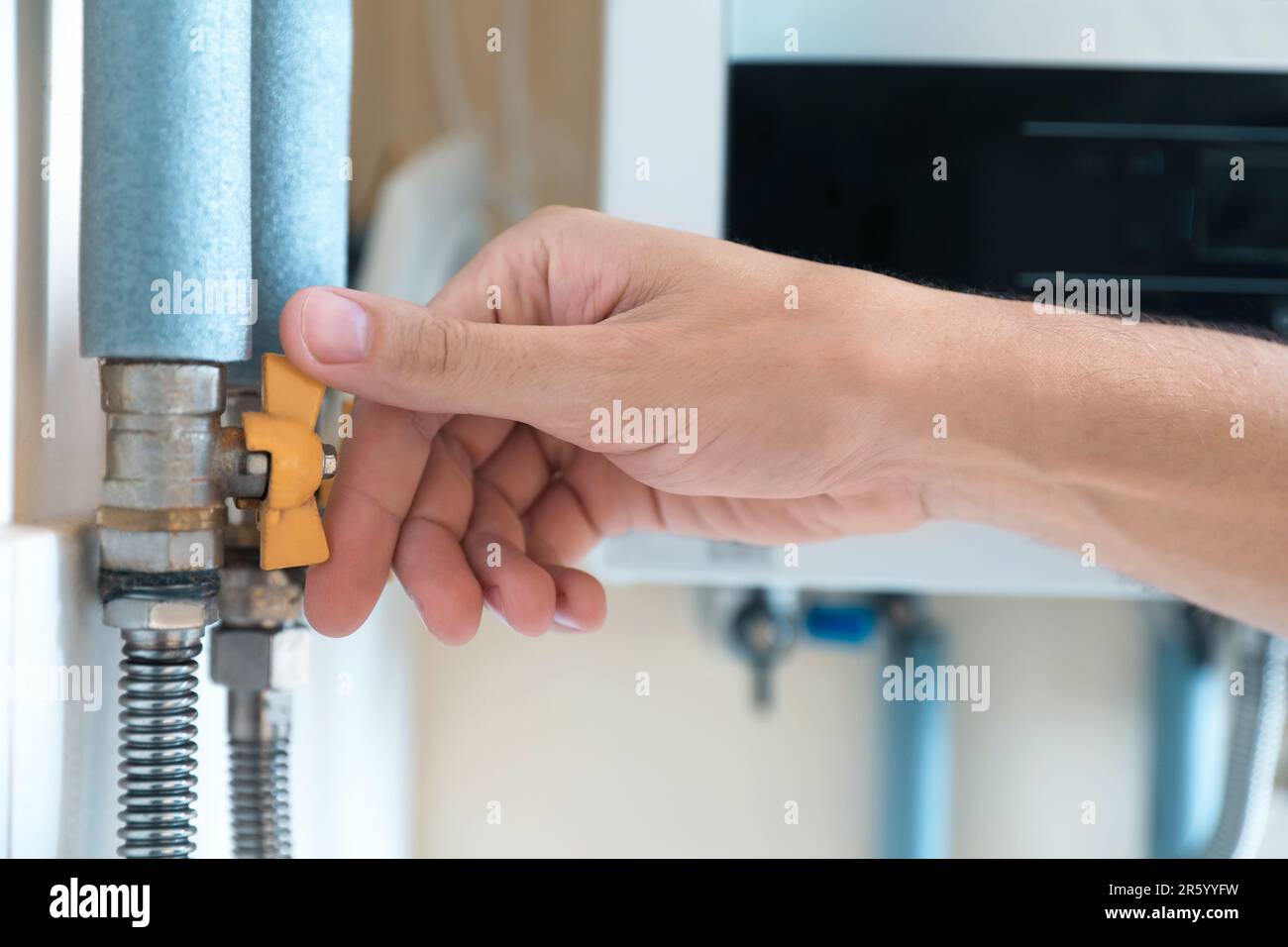 Worker turning valve hi-res stock photography and images - Alamy