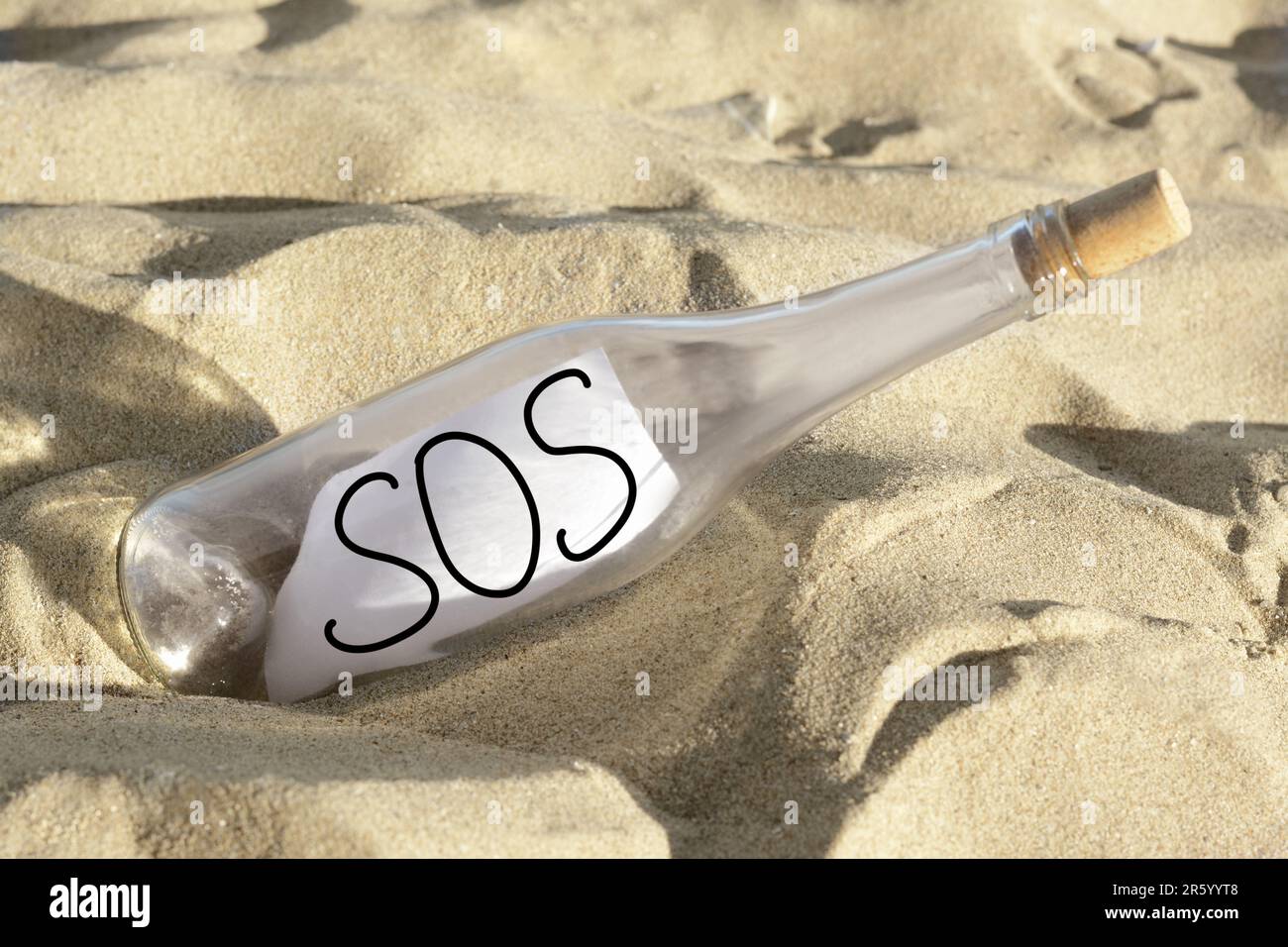 Sos message on sand hi-res stock photography and images - Alamy