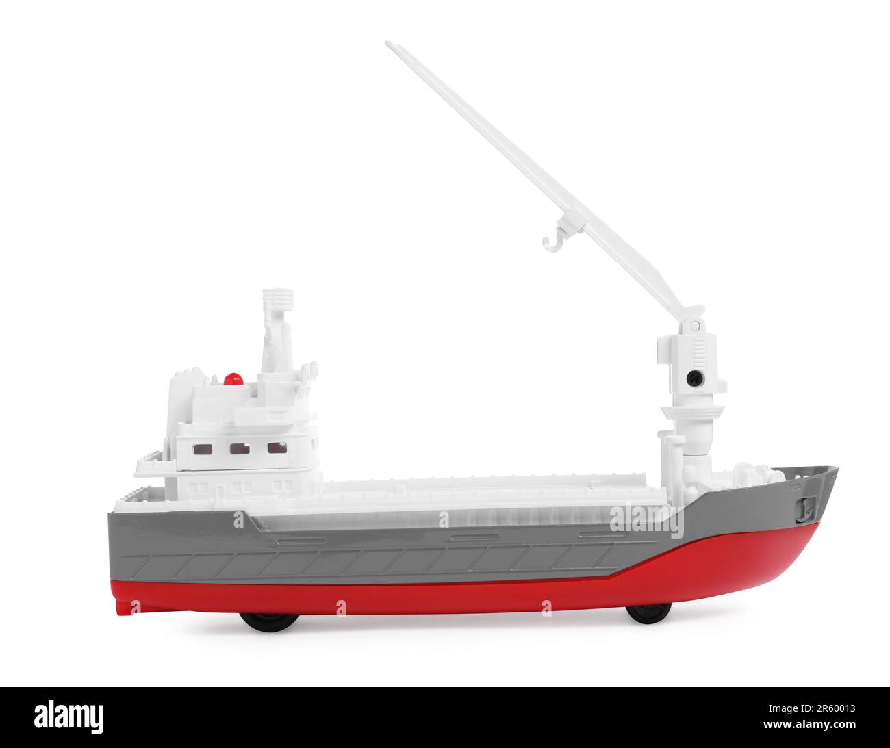 Toy cargo vessel isolated on white. Export concept Stock Photo - Alamy