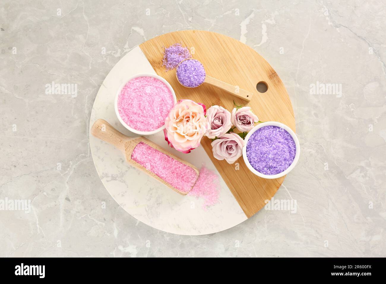 Sea salt and beautiful roses on light grey marble table, top view Stock ...