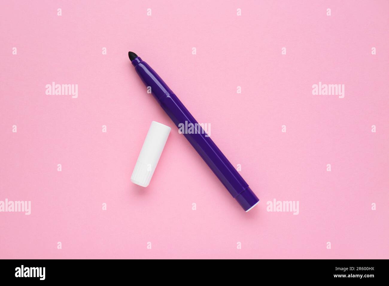Bright purple marker and cap on light pink background, flat lay Stock ...