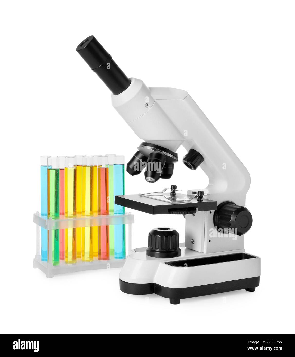 Test tubes with colorful liquids and microscope isolated on white Stock ...