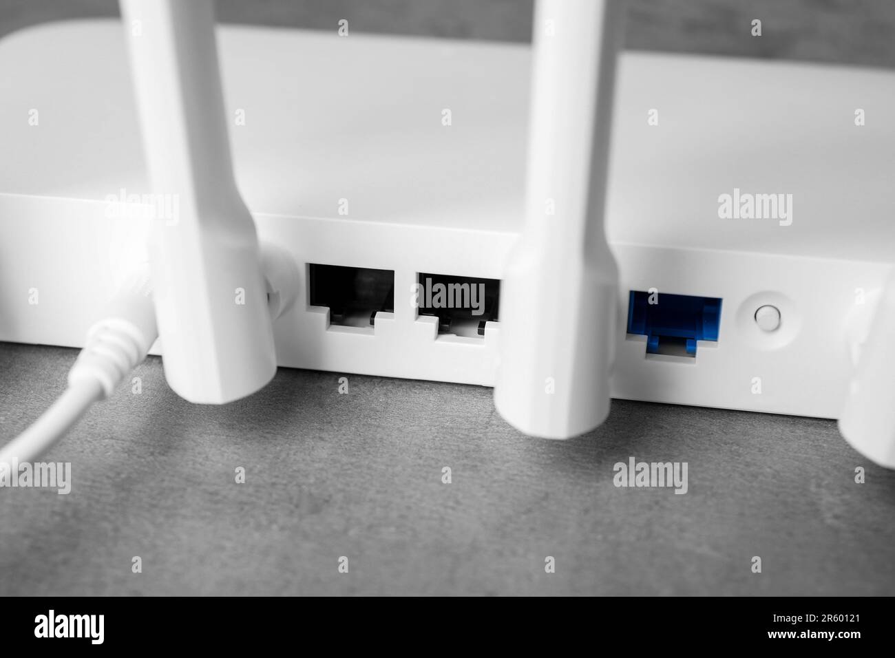 New modern Wi-Fi router on grey table, closeup Stock Photo - Alamy