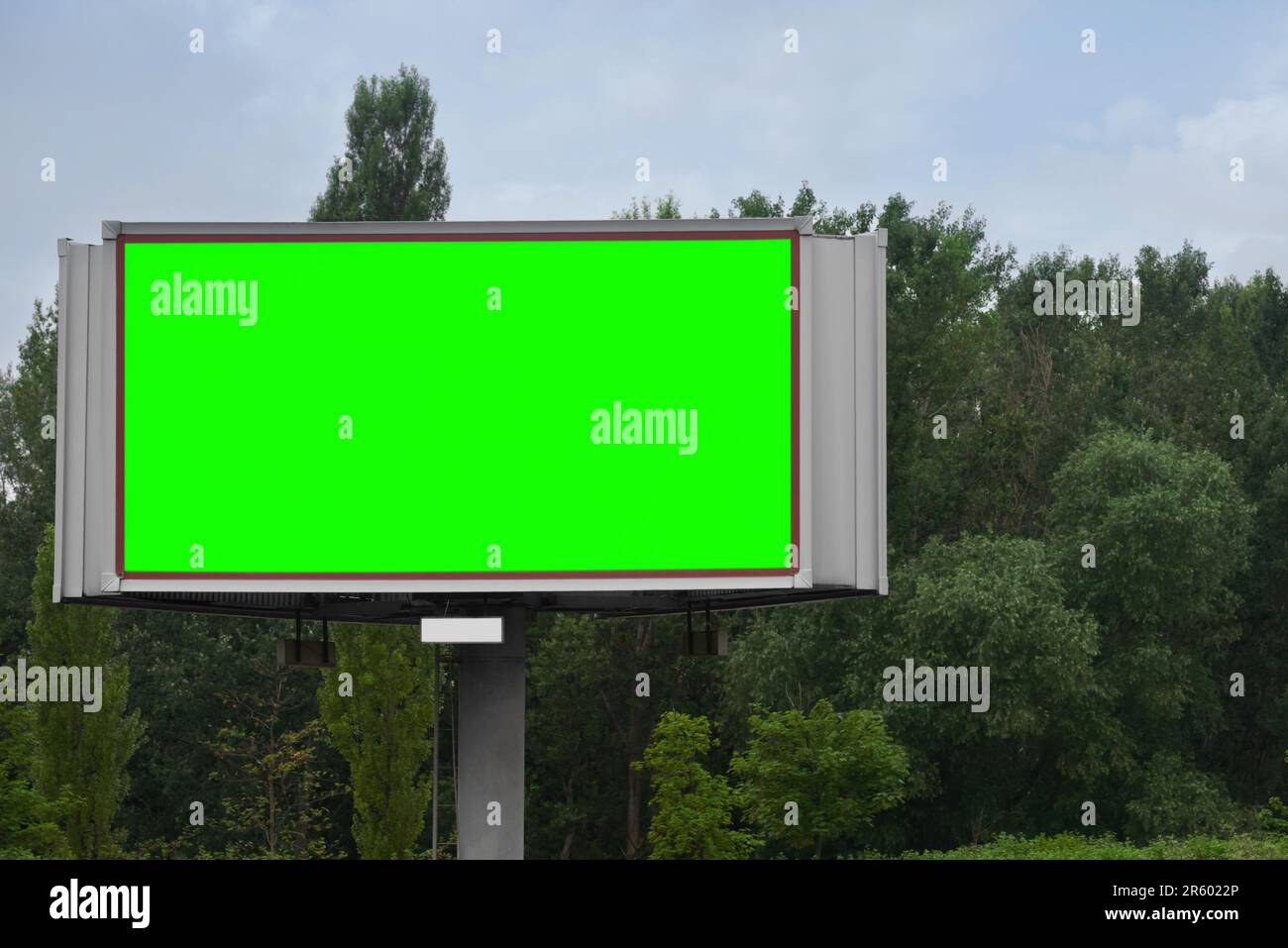 Chroma key compositing. Big empty billboard with green screen outdoors ...