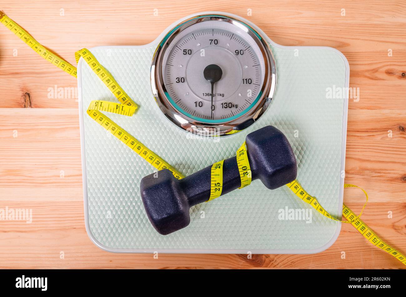 Scale for measuring weight after exercise in the gym Stock Photo - Alamy