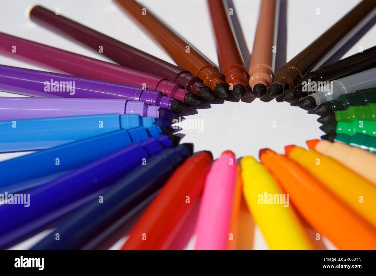 a kit of vivid colored markers forming a circle. crayon of back to ...