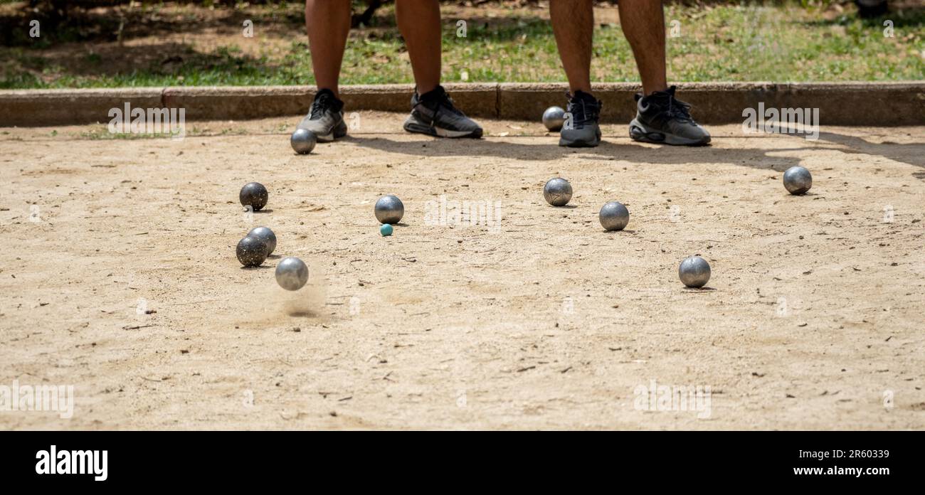 Metal ball from the game of petanque approaching the bowling alley ...