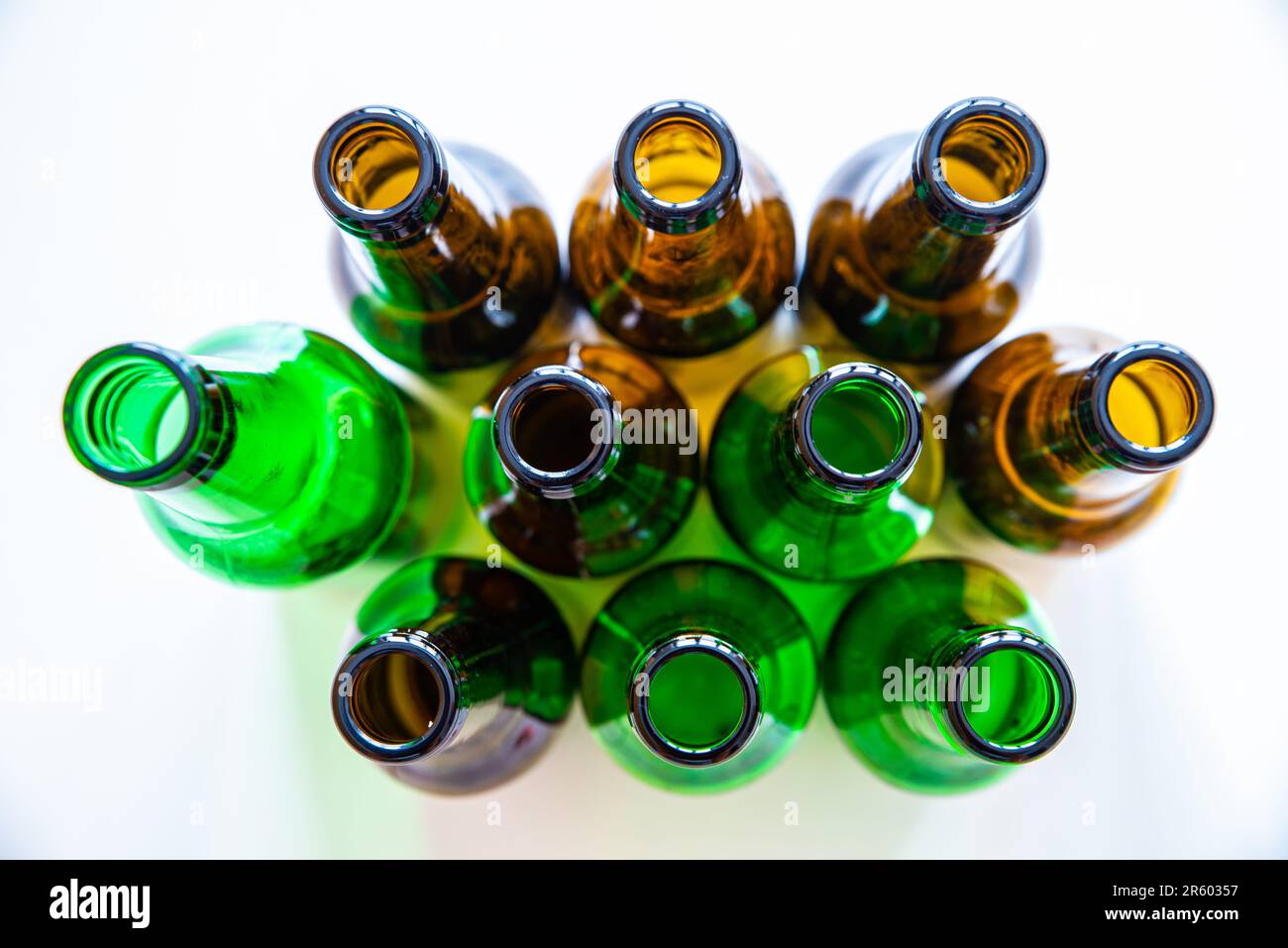 Empty glass beer bottles, brown in color, arranged side by side and ...
