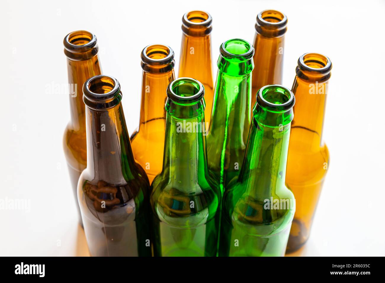Empty glass beer bottles, brown in color, arranged side by side and ...