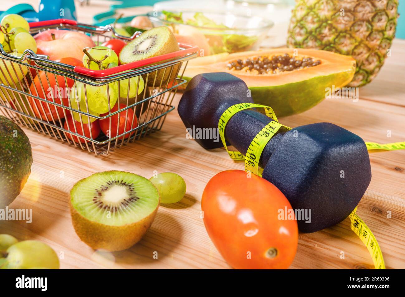 Fitness with dumbbell and genuine food with fresh fruit Stock Photo - Alamy