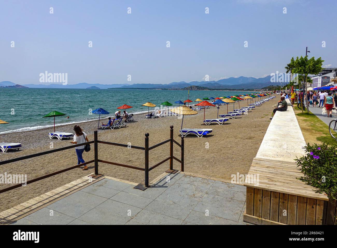 Beach with umbrellas at the popular tourist town of Fethiye turquoise ...