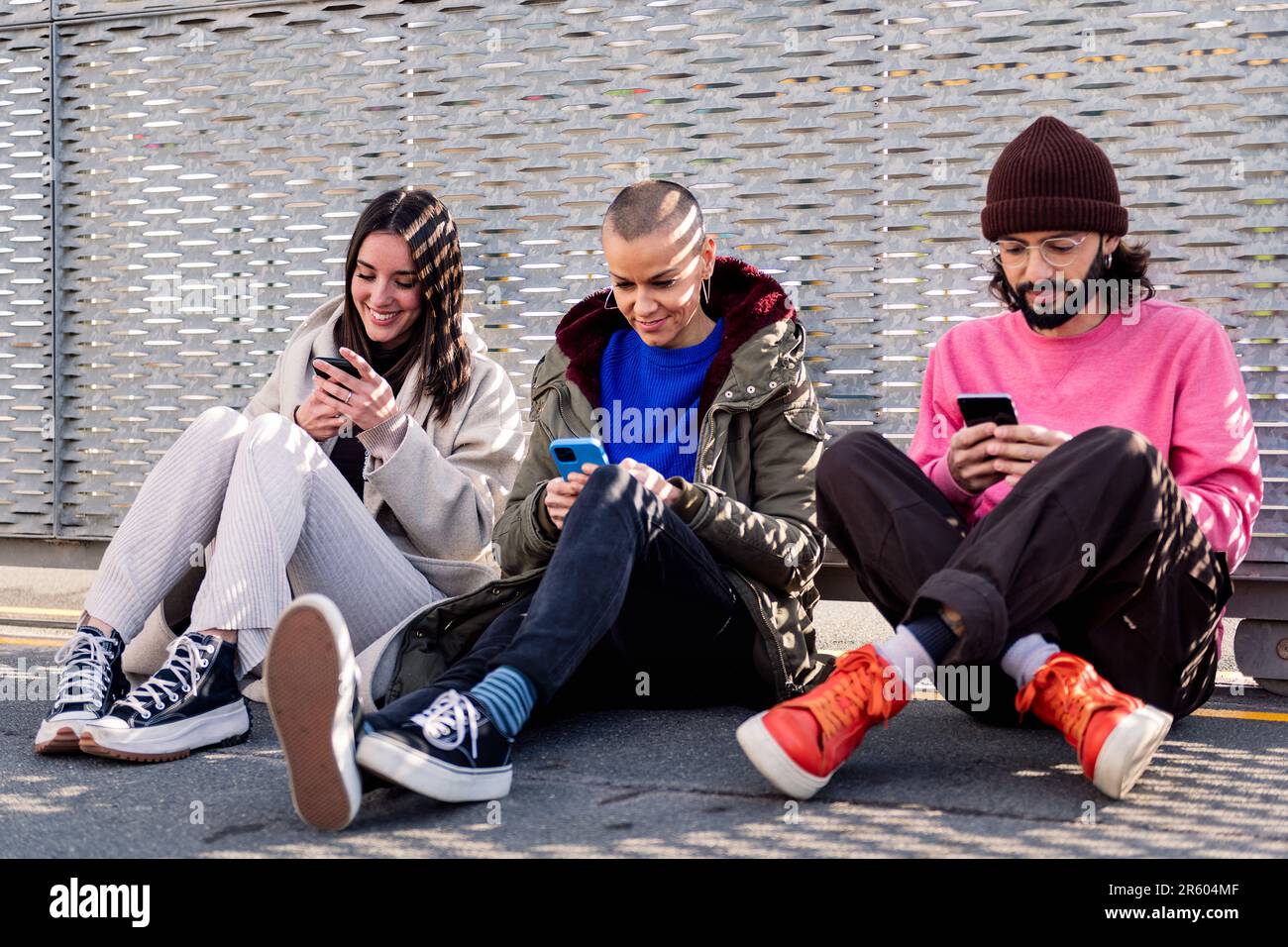 friends scrolling through social media with phone Stock Photo - Alamy