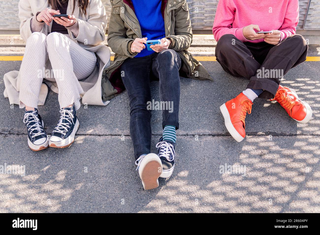 Happy teenage friends browsing internet hi-res stock photography and ...