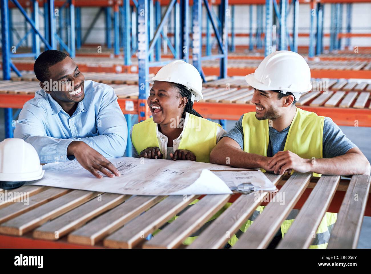 Business people, architect and blueprint laughing in construction ...