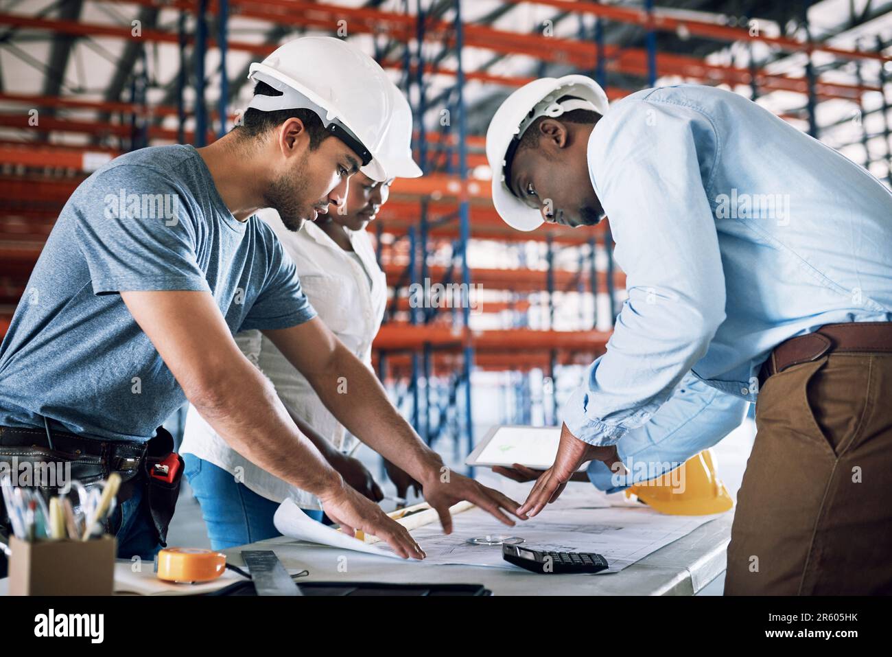 Business people, blueprint and documents in team construction, planning ...