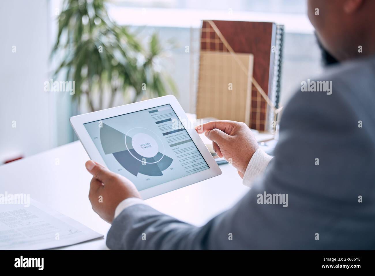 Hands typing, tablet and charts in office for customer expansion, sales analysis and statistics ...