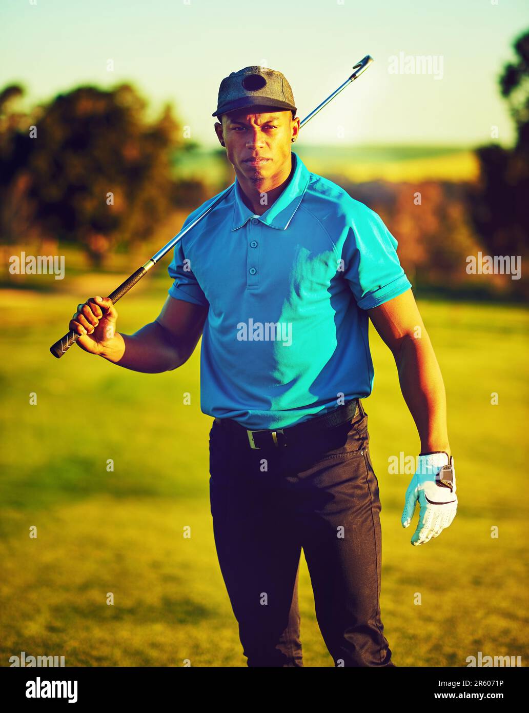 Golf is a game for the tough minded. a young man playing golf Stock ...