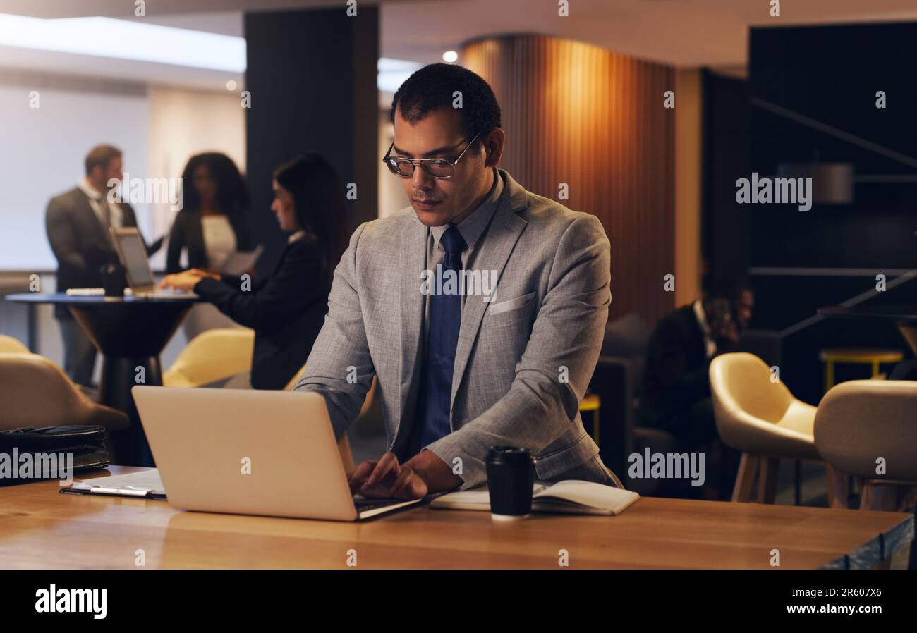 Laptop, corporate lobby and business man review economy report, online analysis or typing web ...