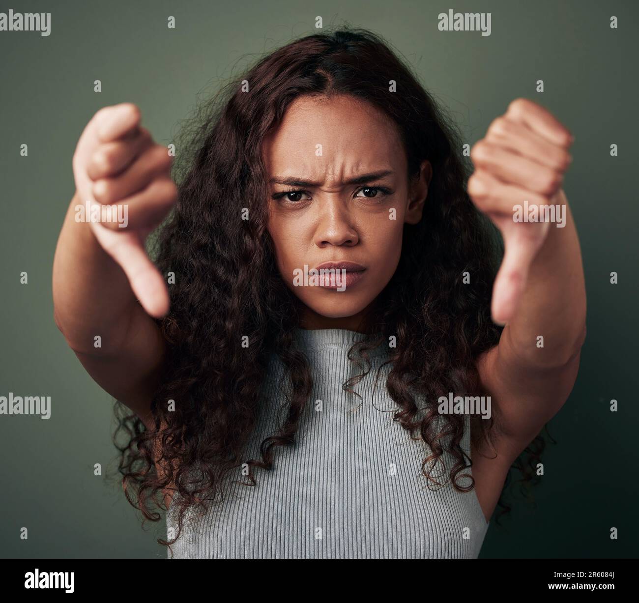 Woman, thumbs down and angry, fail with hands, disagreement and ...