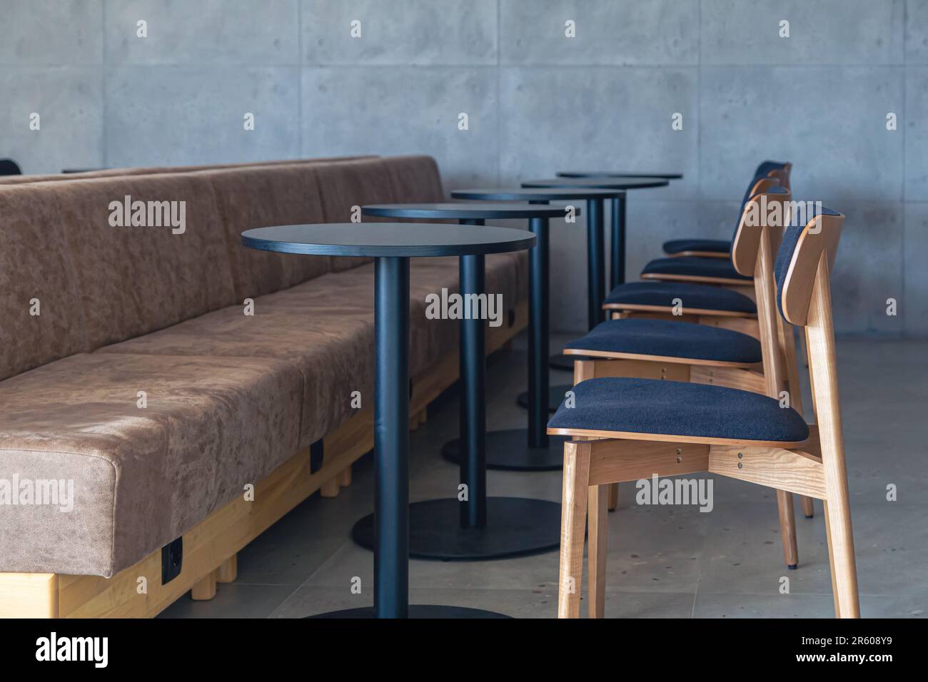 Interior of a modern cafe with sofas, chairs and tables Stock Photo - Alamy